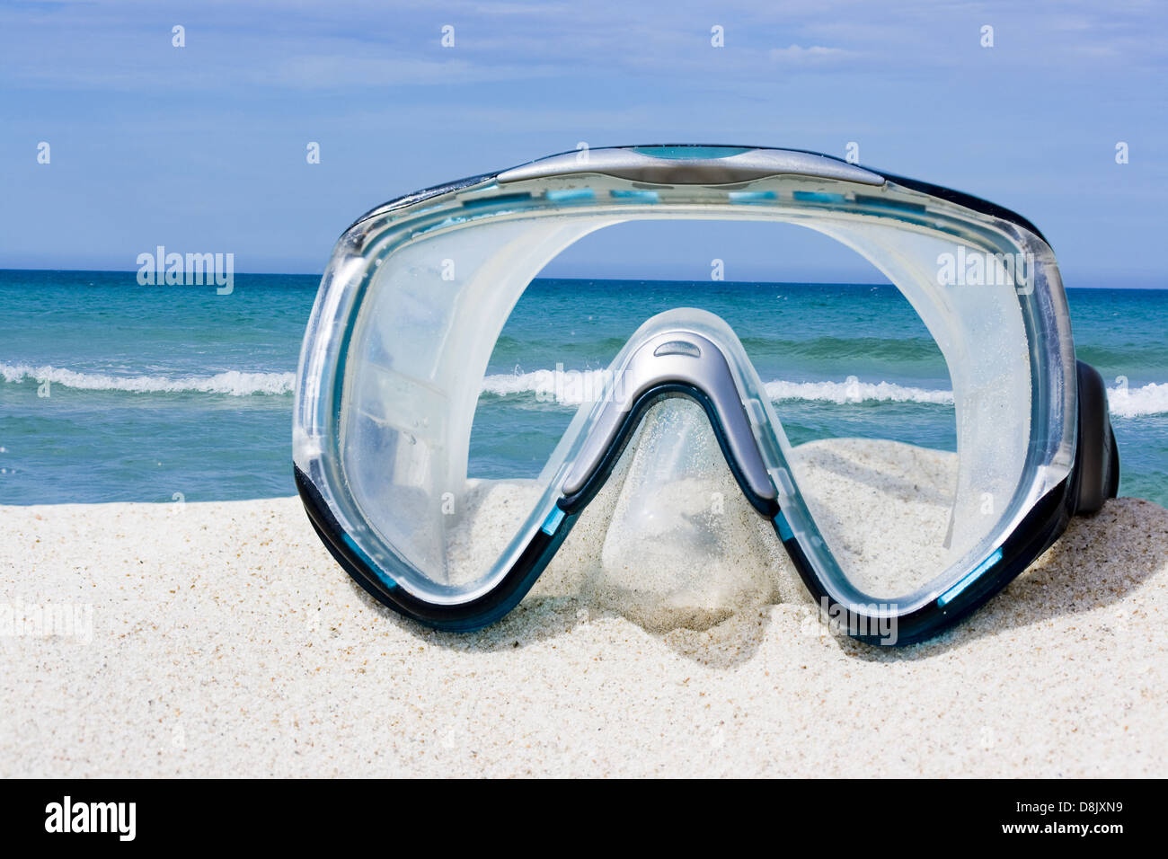 Mask on white sand beach Stock Photo - Alamy