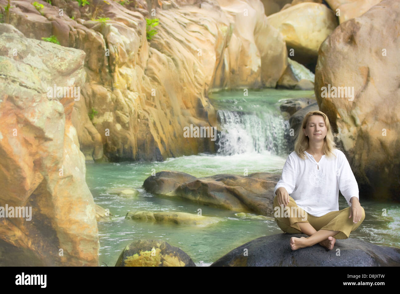 Young woman on waterfall background Stock Photo - Alamy