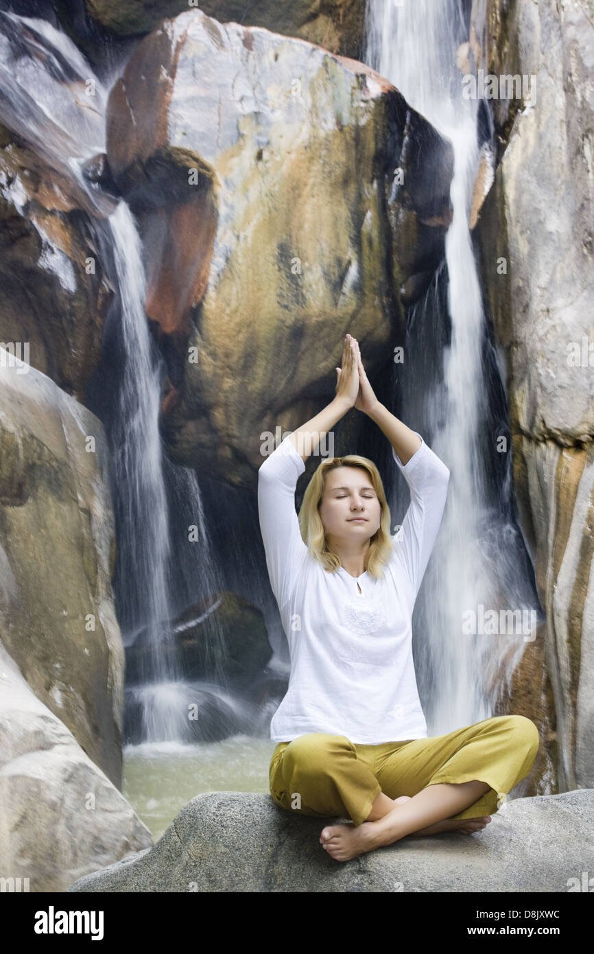 Young woman doing yoga exercises Stock Photo - Alamy