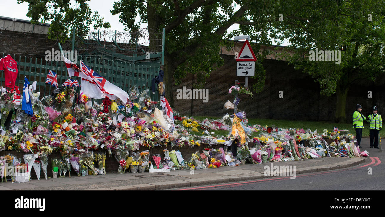 Flower are left at the scene where Drummer Lee Rigby was killed outside ...