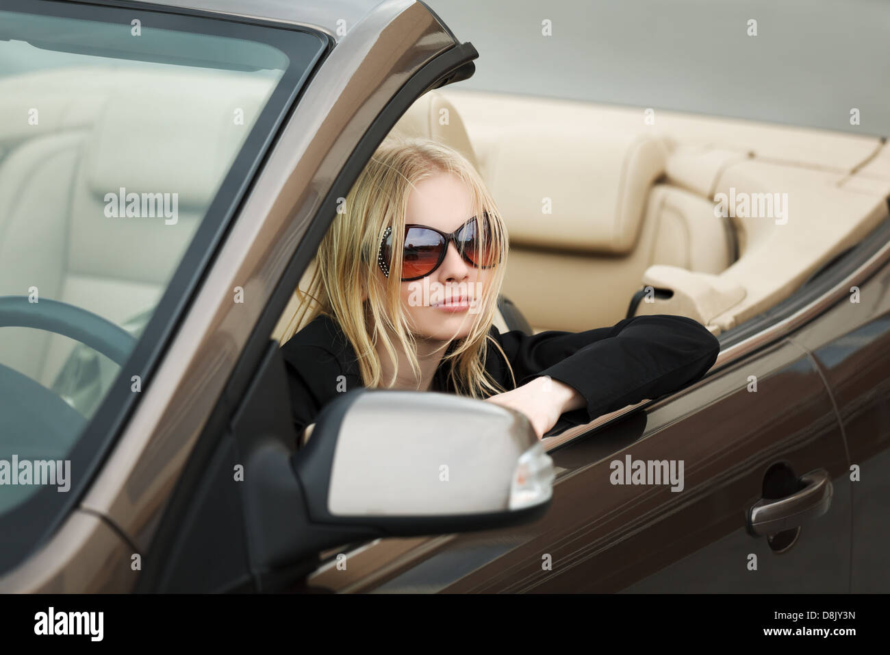 Young woman in a convertible car Stock Photo - Alamy