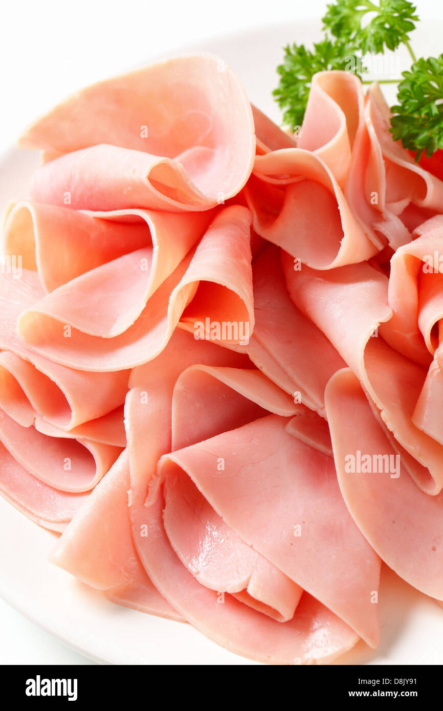 Thinly sliced ham on plate Stock Photo - Alamy