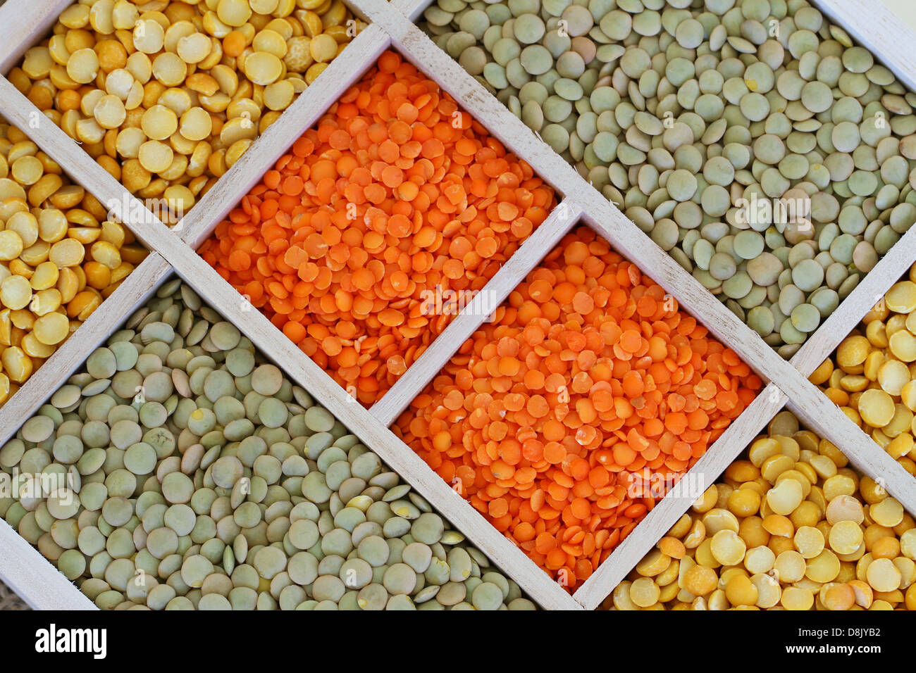 Selection of lentils in wooden compartments Stock Photo - Alamy