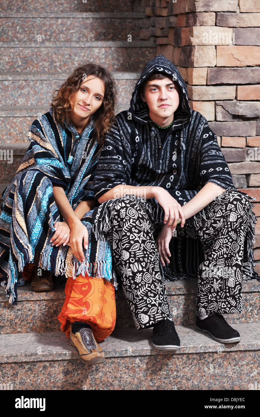 Young hippie couple sitting on the steps Stock Photo - Alamy