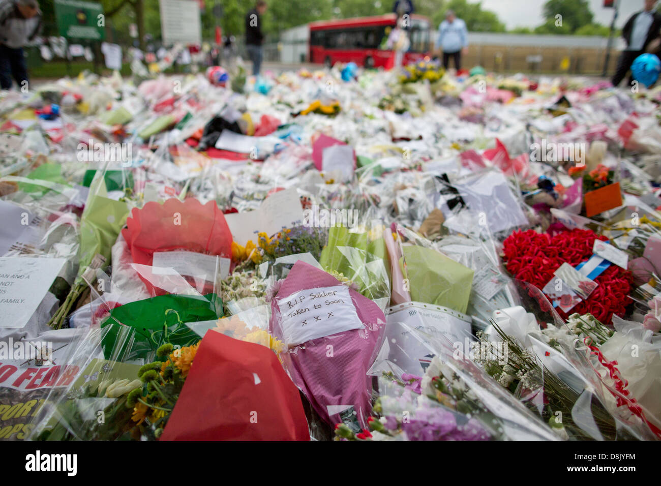Flower are left at the scene where Drummer Lee Rigby was killed outside ...