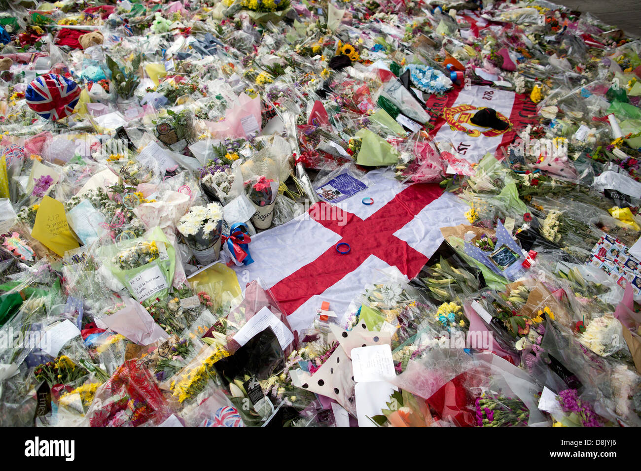 Flower are left at the scene where Drummer Lee Rigby was killed outside ...