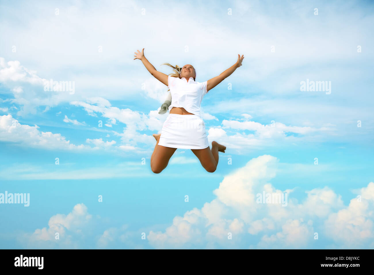 Jumping in clouds Stock Photo - Alamy