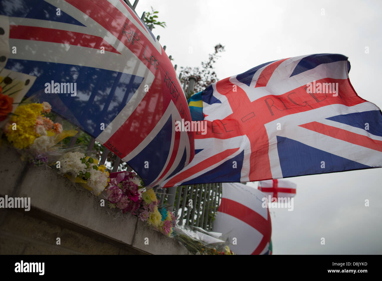 Flower are left at the scene where Drummer Lee Rigby was killed outside ...