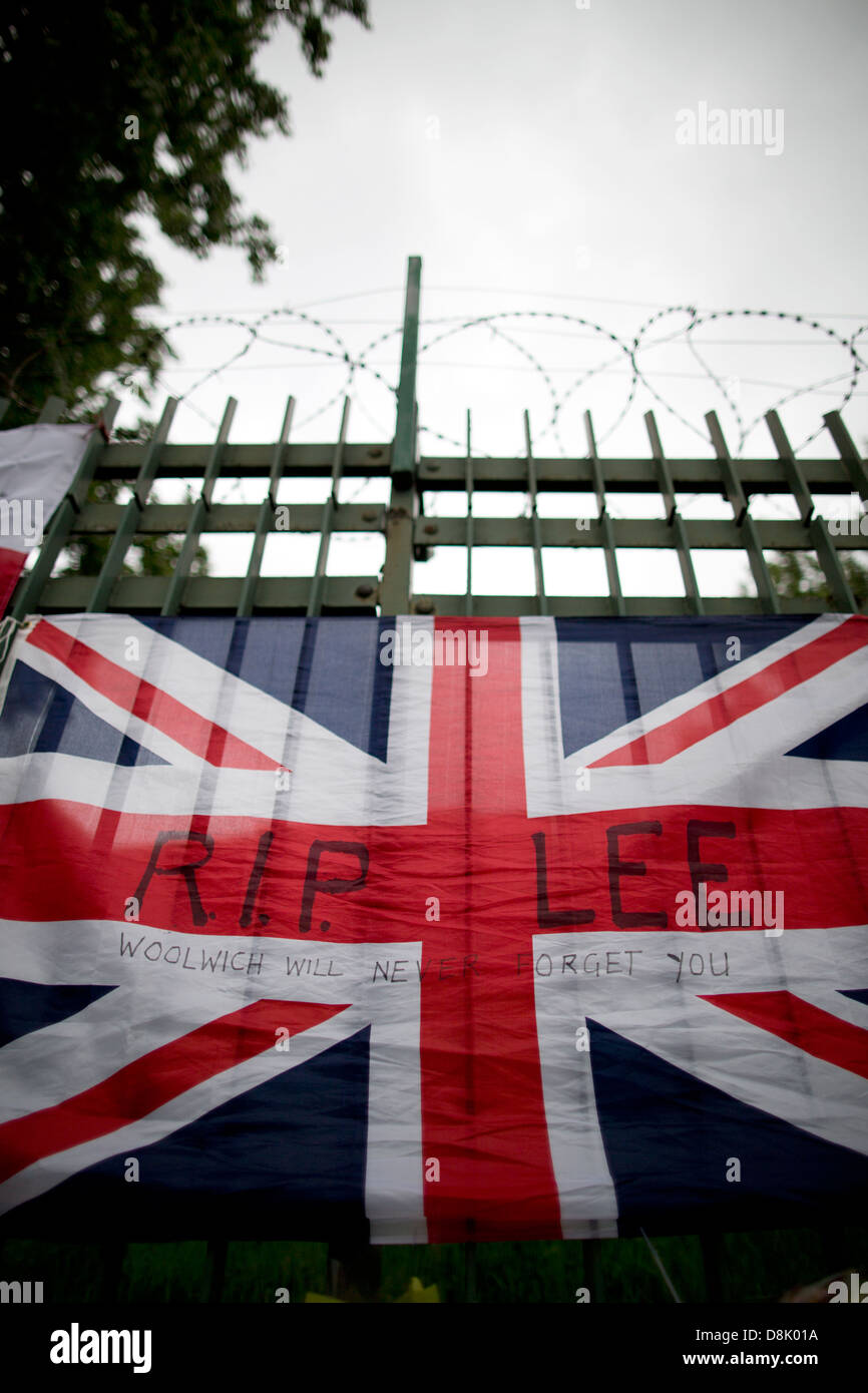 Flower are left at the scene where Drummer Lee Rigby was killed outside ...