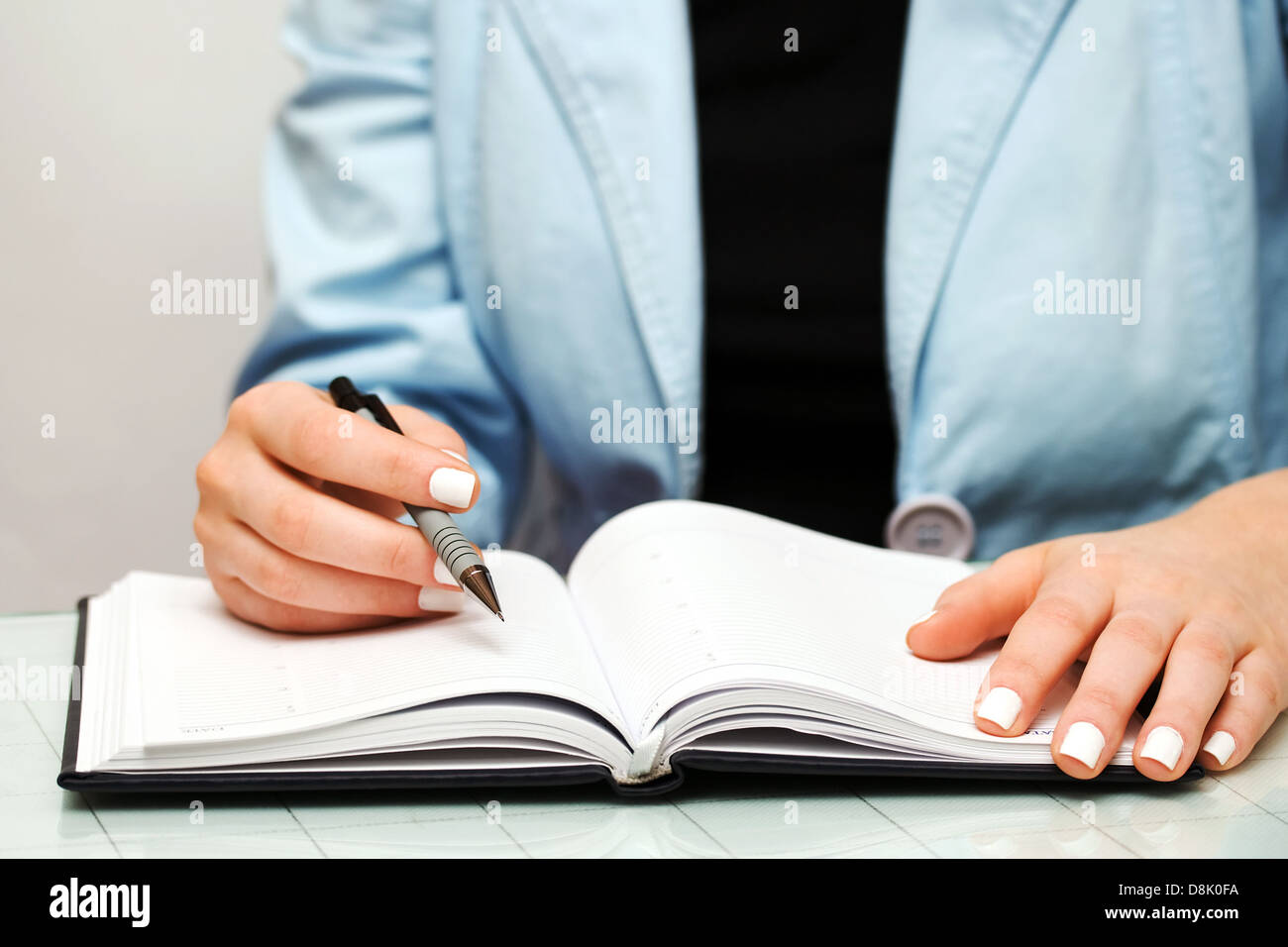 Female hands writing Stock Photo - Alamy