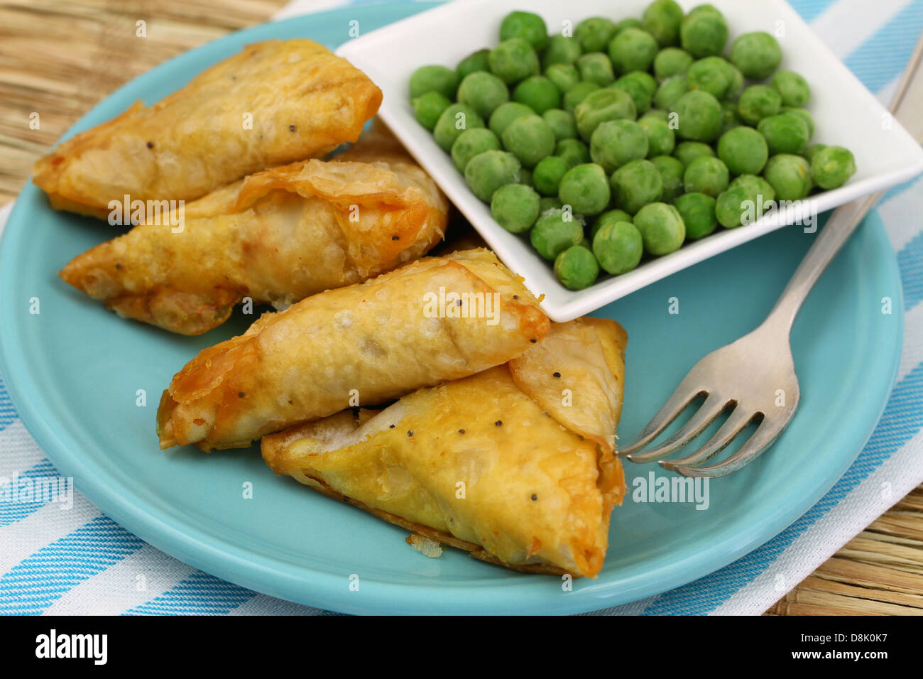 Vegetarian samosas and green peas, close up Stock Photo - Alamy