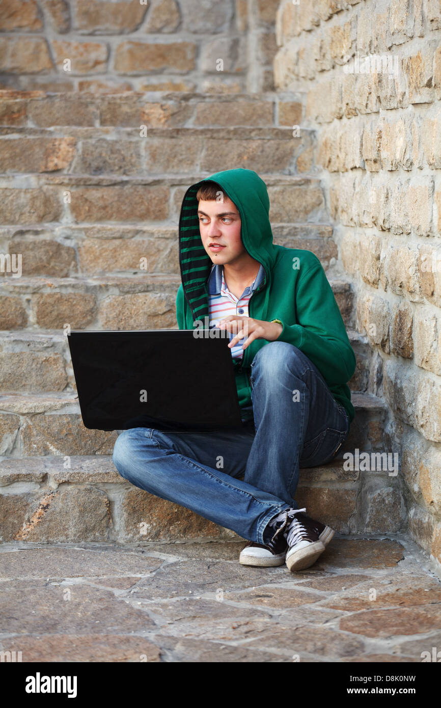 Young man with laptop Stock Photo - Alamy