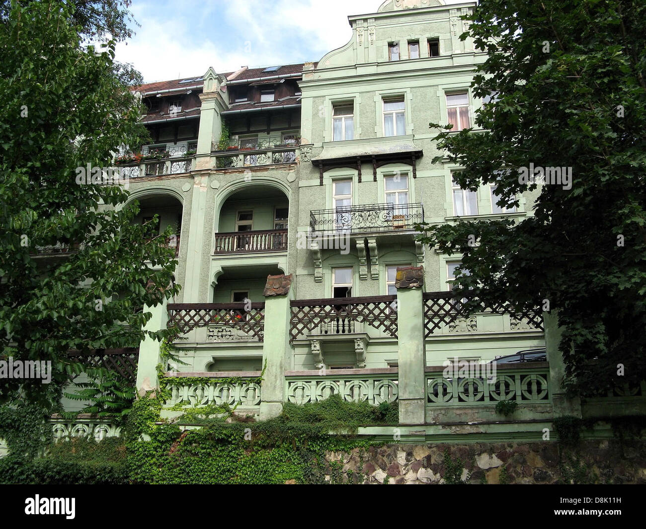 A residential house with a traditional design, featuring a well ...