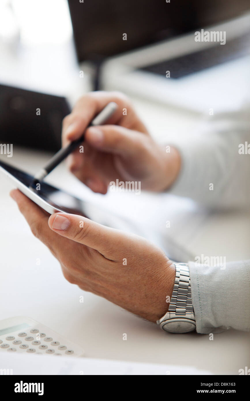 Man using digital tablet and stylus, cropped Stock Photo - Alamy