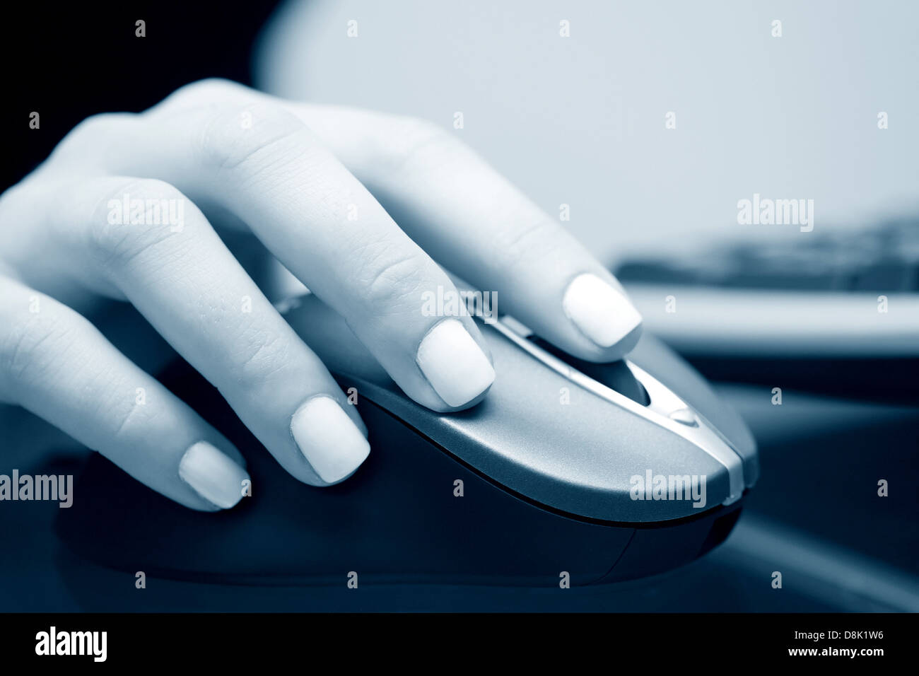Female hand holding computer mouse Stock Photo - Alamy