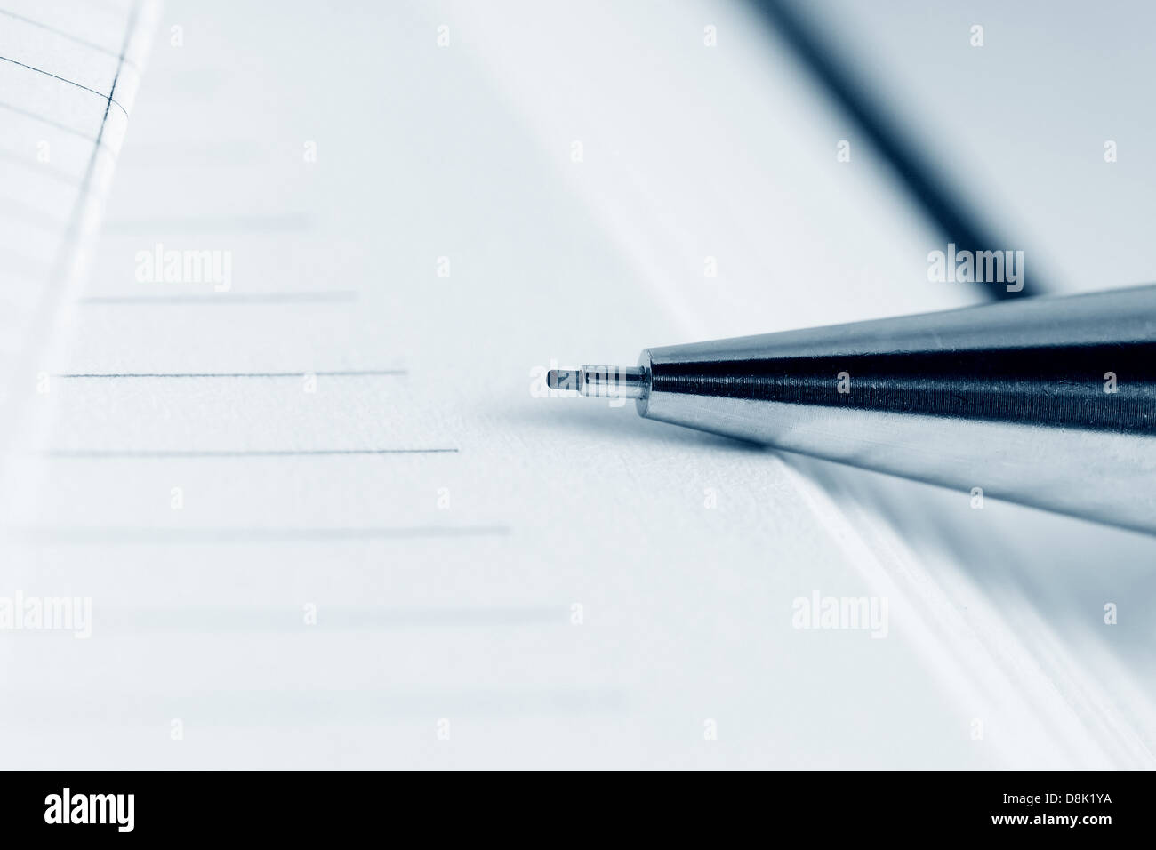 Pen on the notebook Stock Photo - Alamy