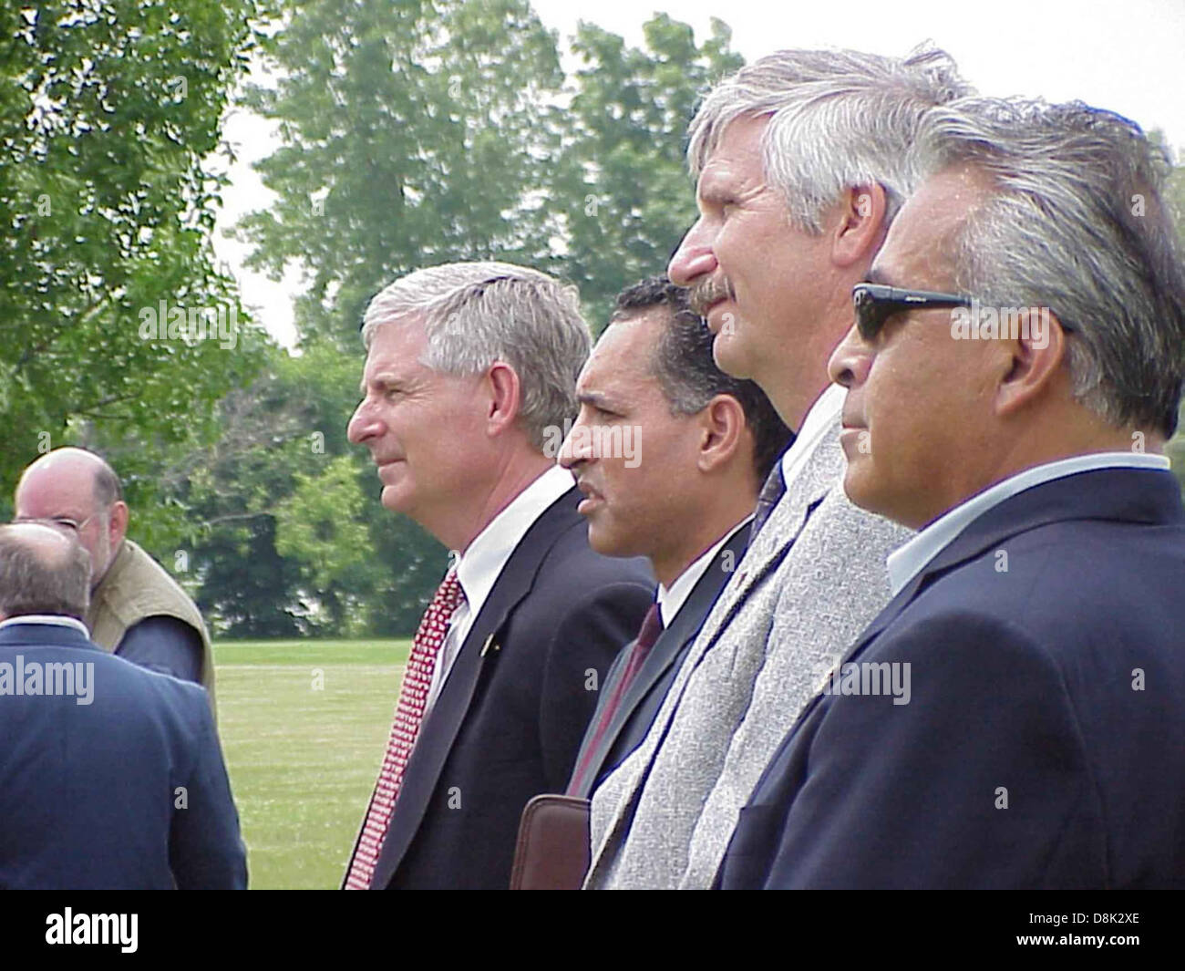 Several men in fancy suits standing side by side Stock Photo - Alamy