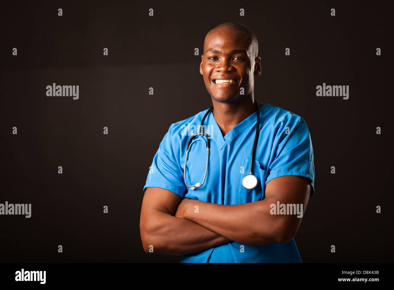 young African American medical doctor portrait over black background ...