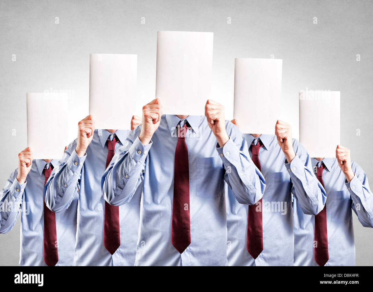Businessmen holdings blank paper over their heads Stock Photo - Alamy