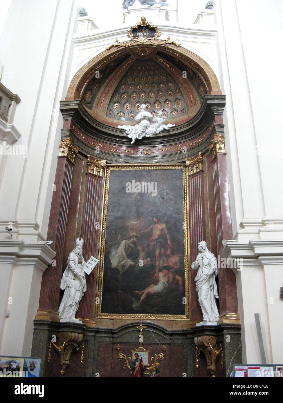 This image captures statues within a Catholic church, showcasing ...