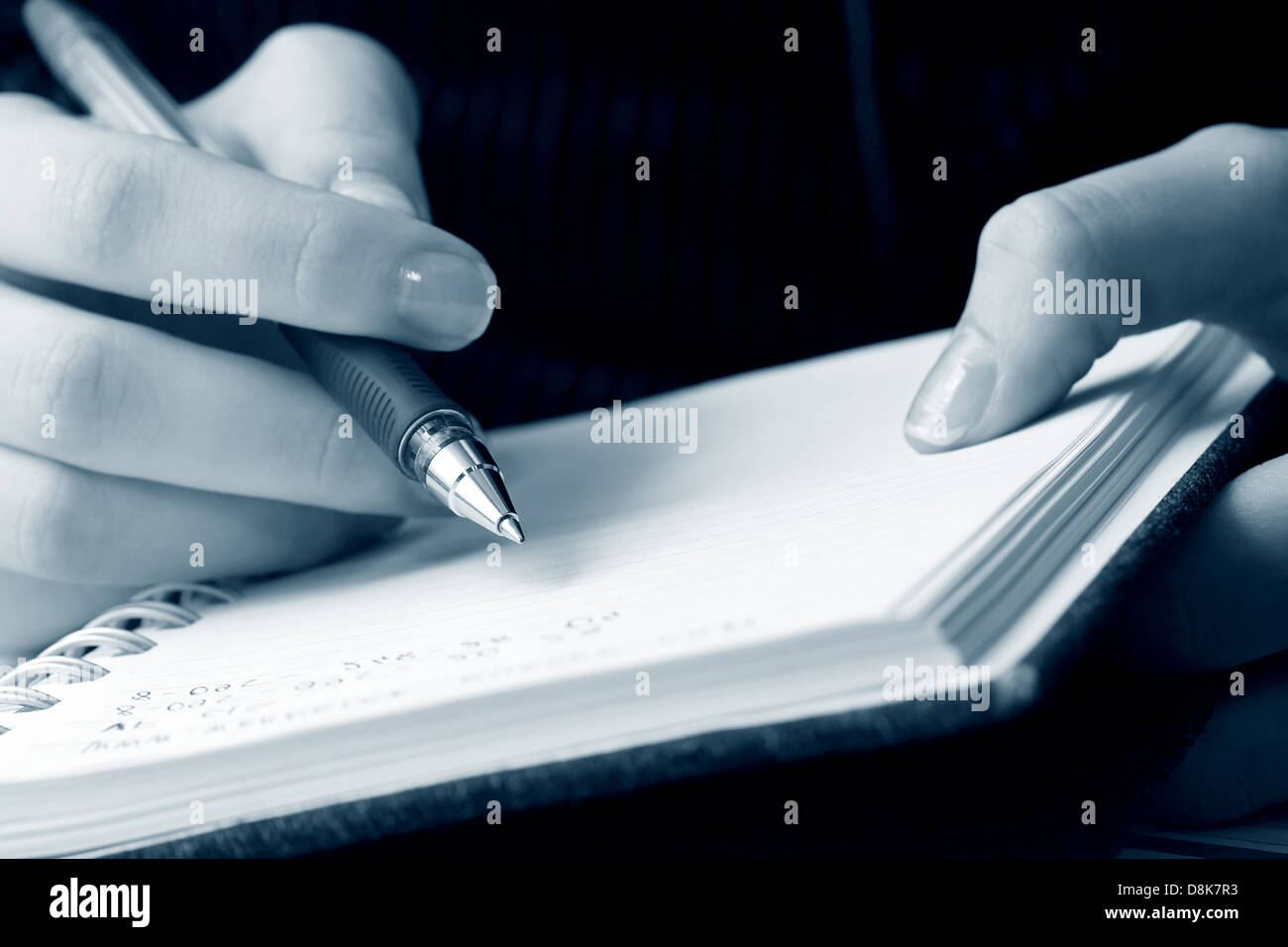 Female hand writing Stock Photo - Alamy