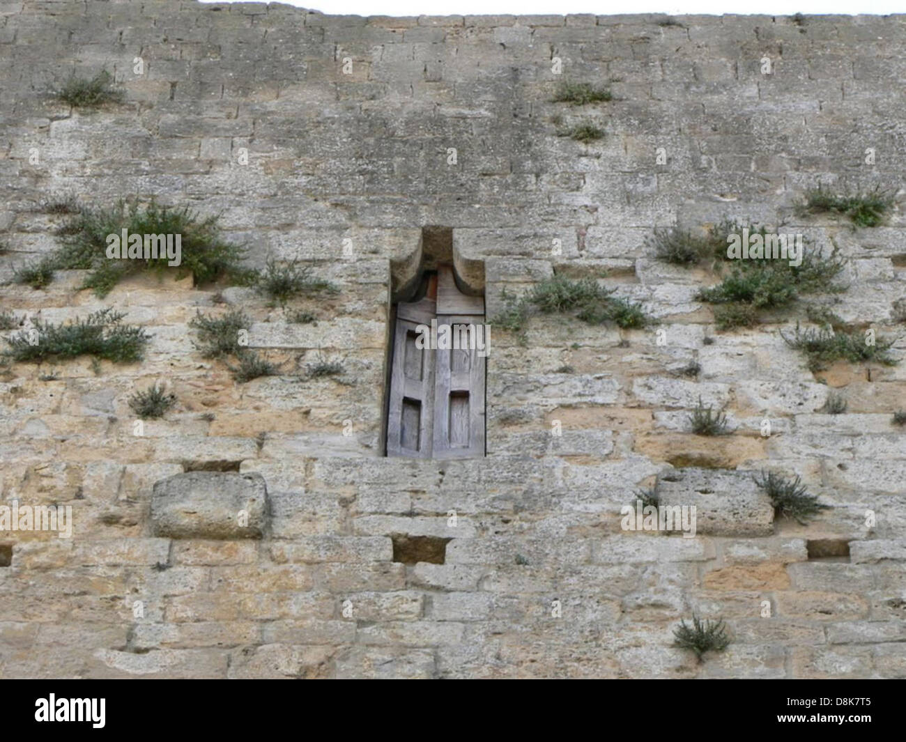 Stone wall hatch Stock Photo - Alamy