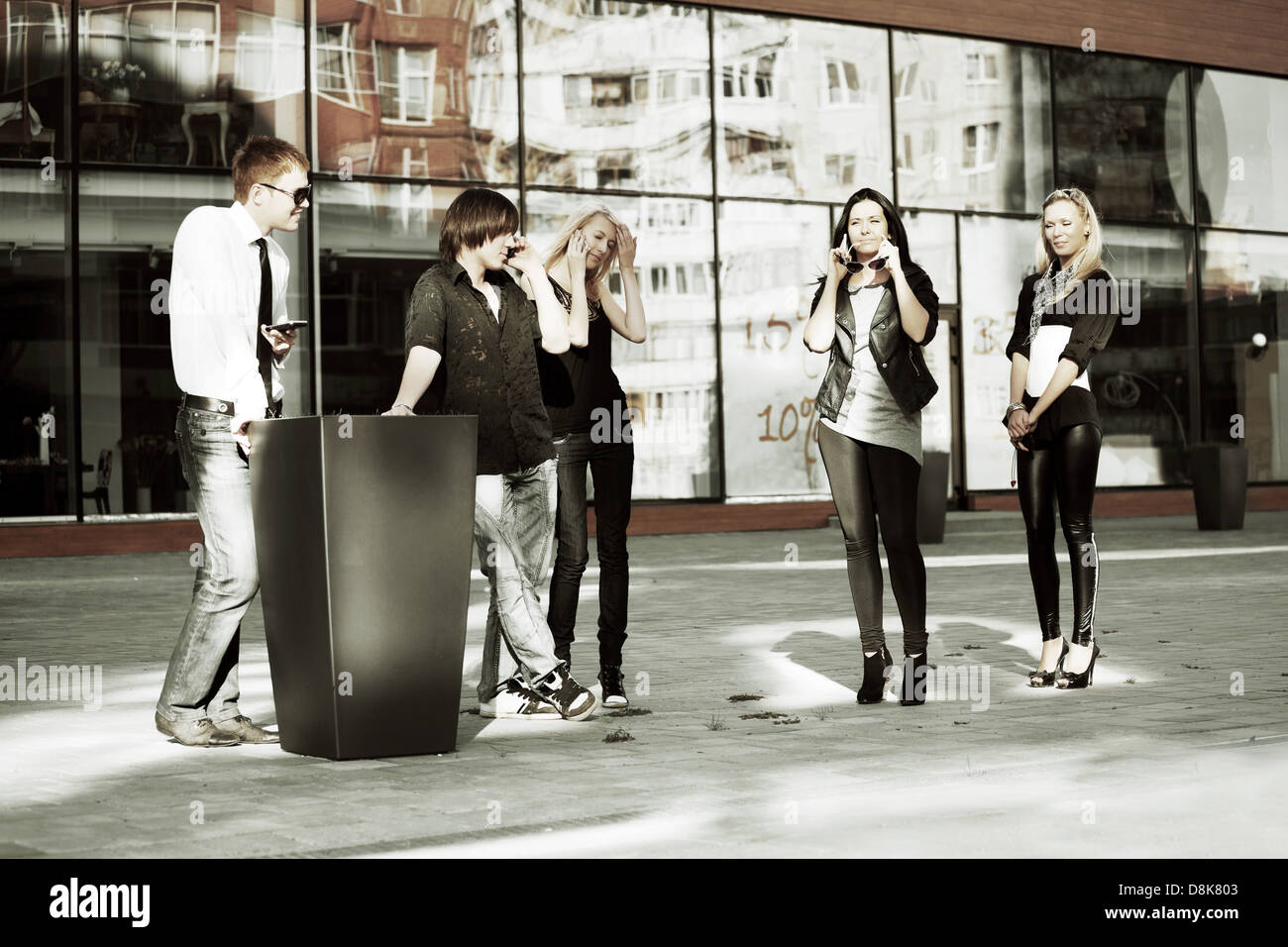 Young people calling on the phones Stock Photo - Alamy