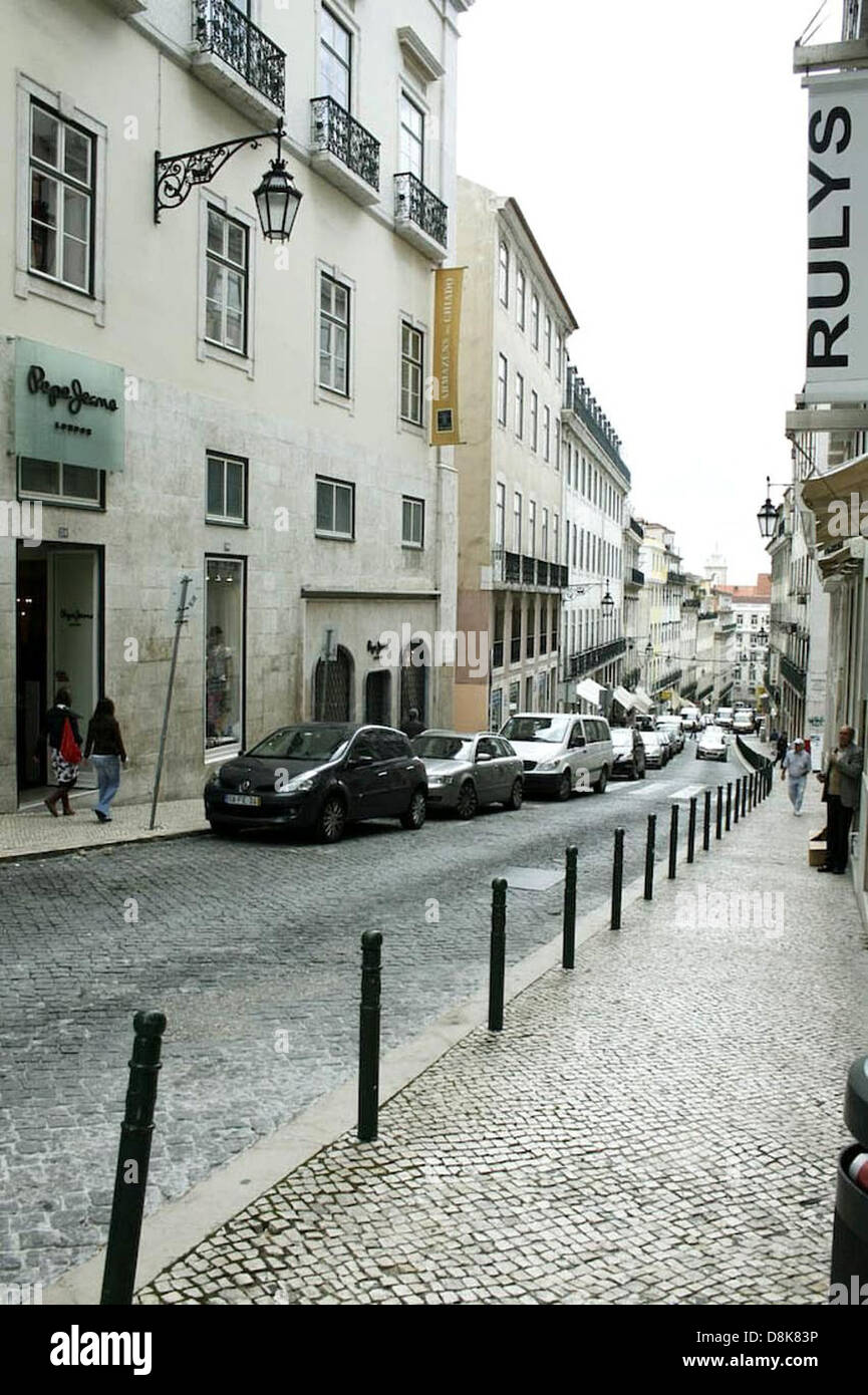 A busy urban street scene showcasing the part of town with buildings ...