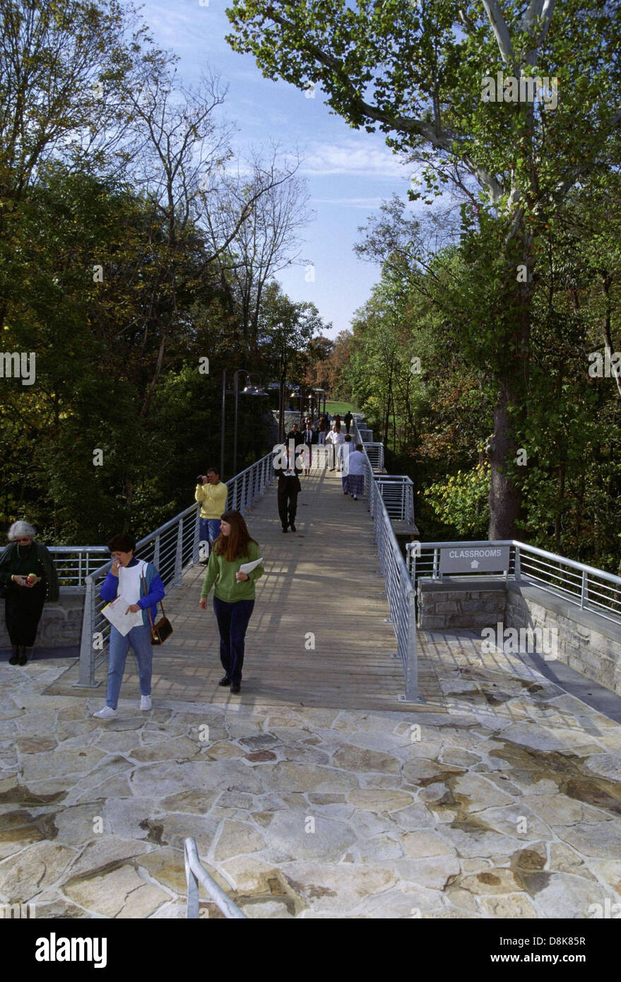 Students walking across the bridge Stock Photo - Alamy
