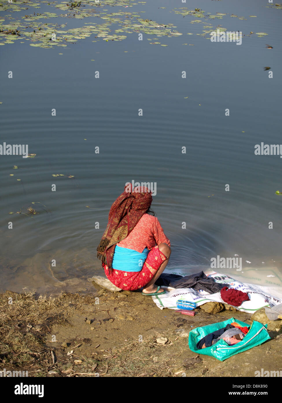 woman washing clothes in Nepal Stock Photo - Alamy