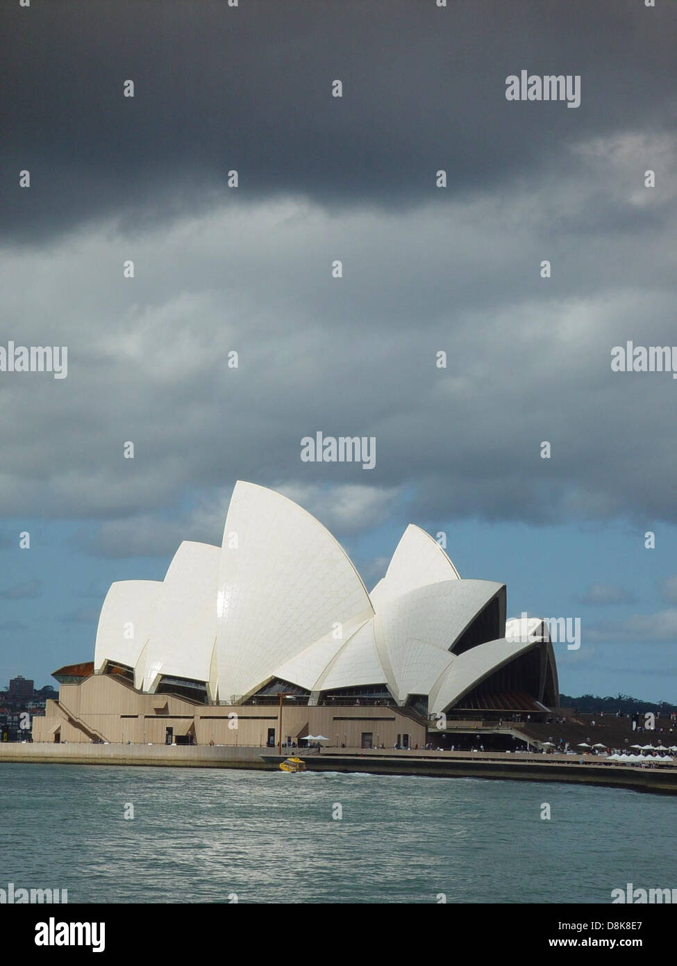 Sydney opera house in sunlight backed by cloud Stock Photo - Alamy