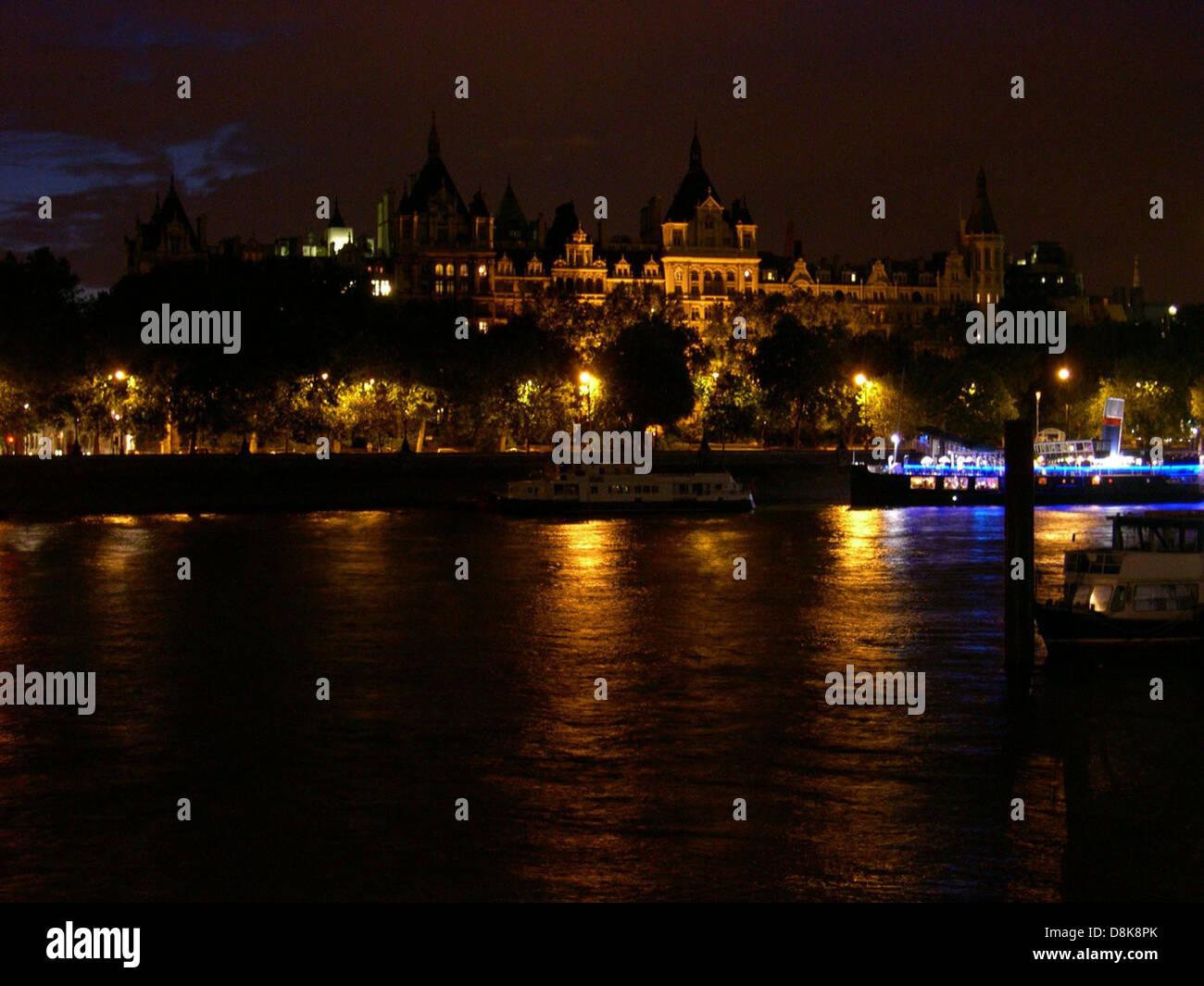 The River Thames flows through central London at night, with the city's ...