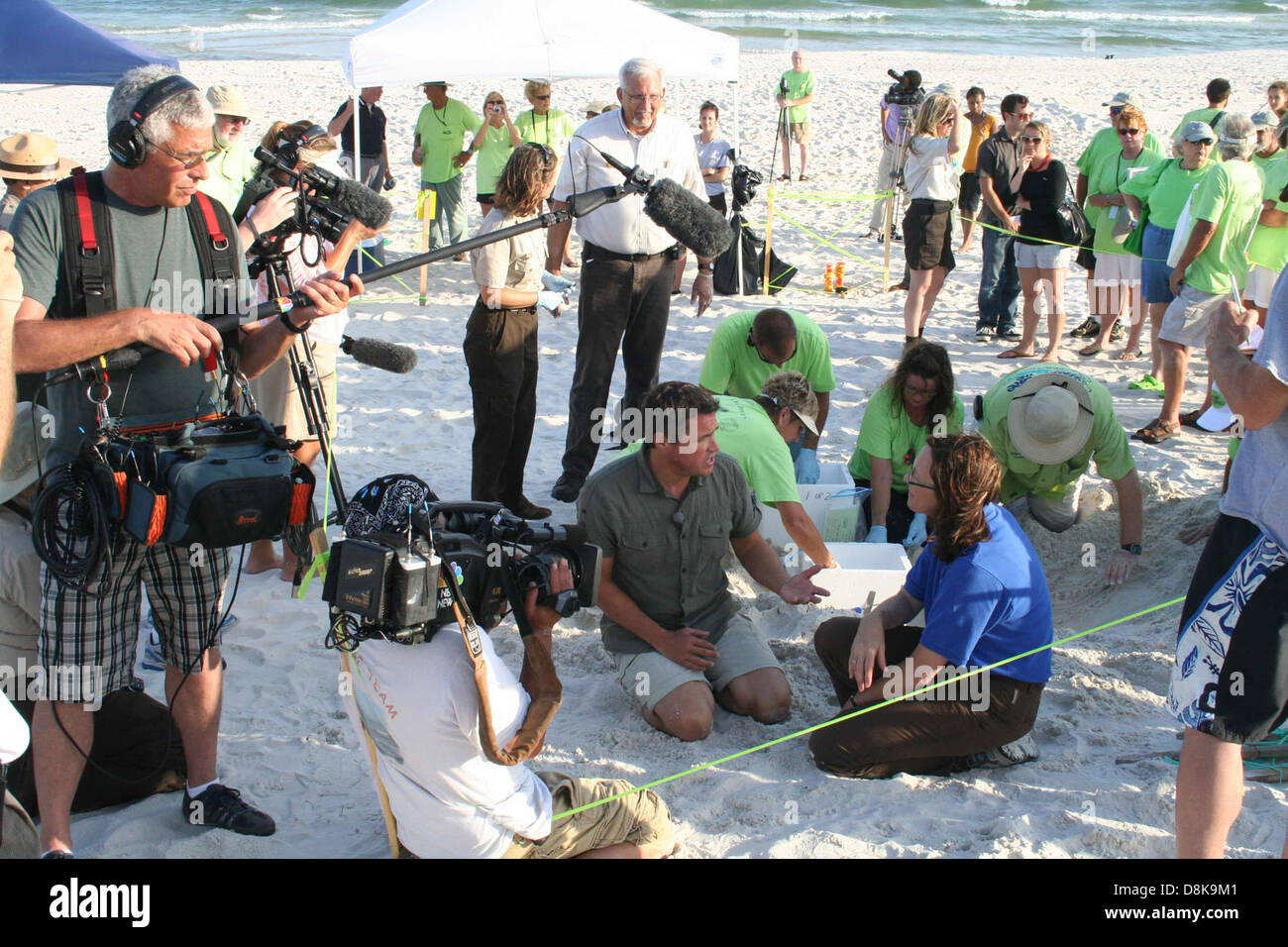 A TV crew filming a documentary, with cameras and equipment set up in ...