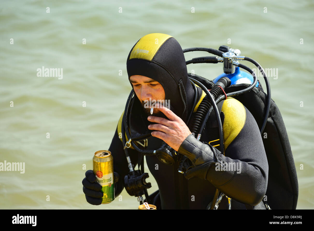 A diver smoking a cigarette Stock Photo - Alamy