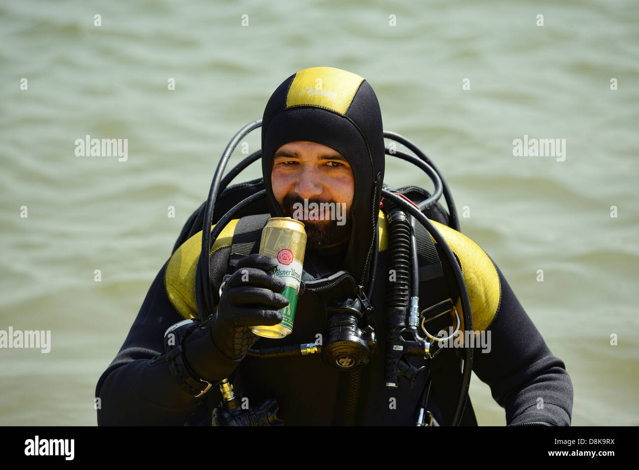 A diver drinking beer can Stock Photo - Alamy