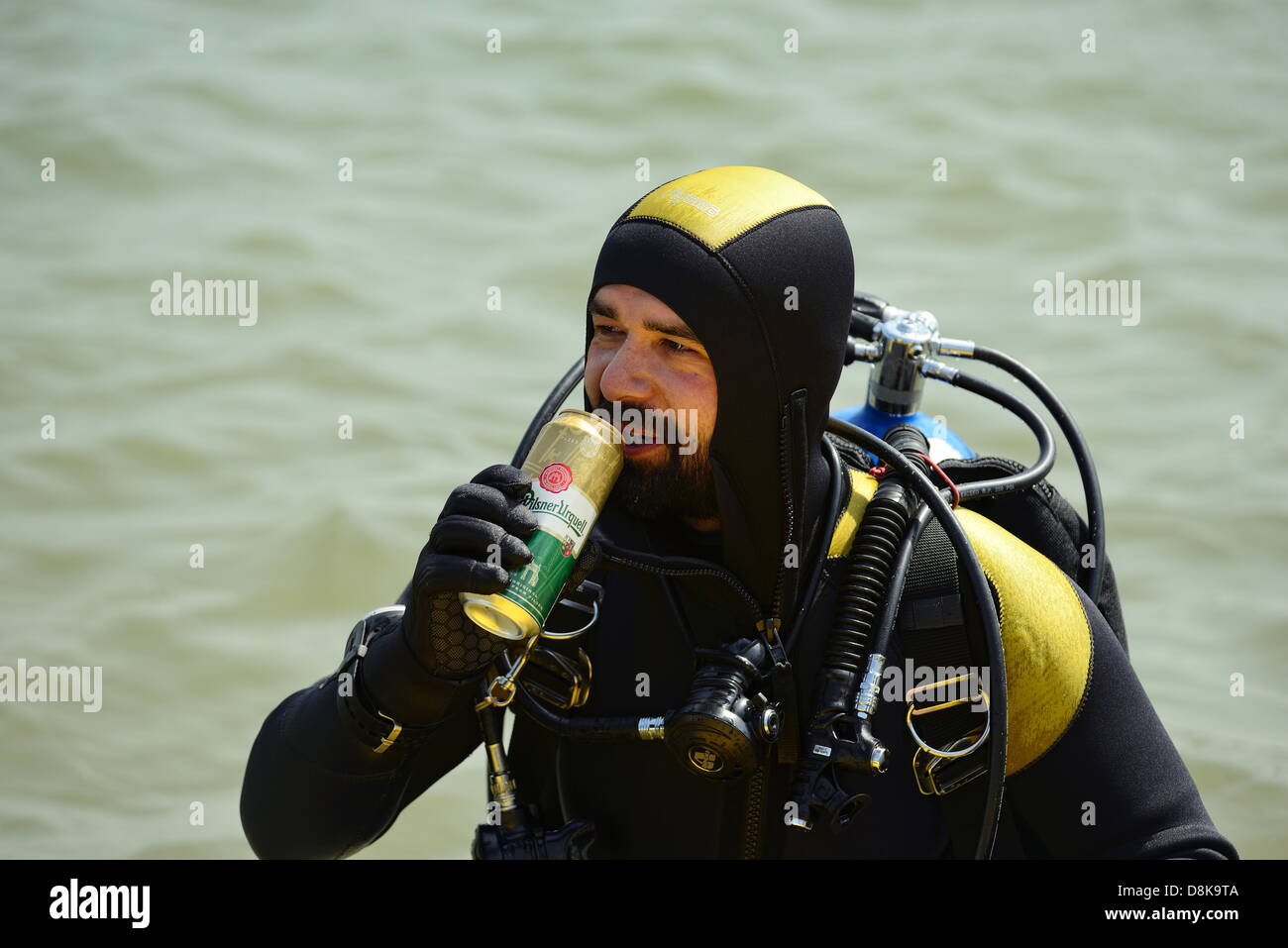A diver drinking beer can Stock Photo - Alamy