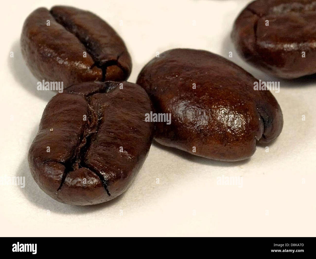 A close-up image of ground coffee beans, showcasing their rich brown ...