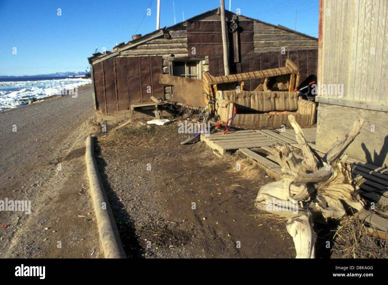 A picturesque village scene featuring wooden homes. The simple, rustic ...