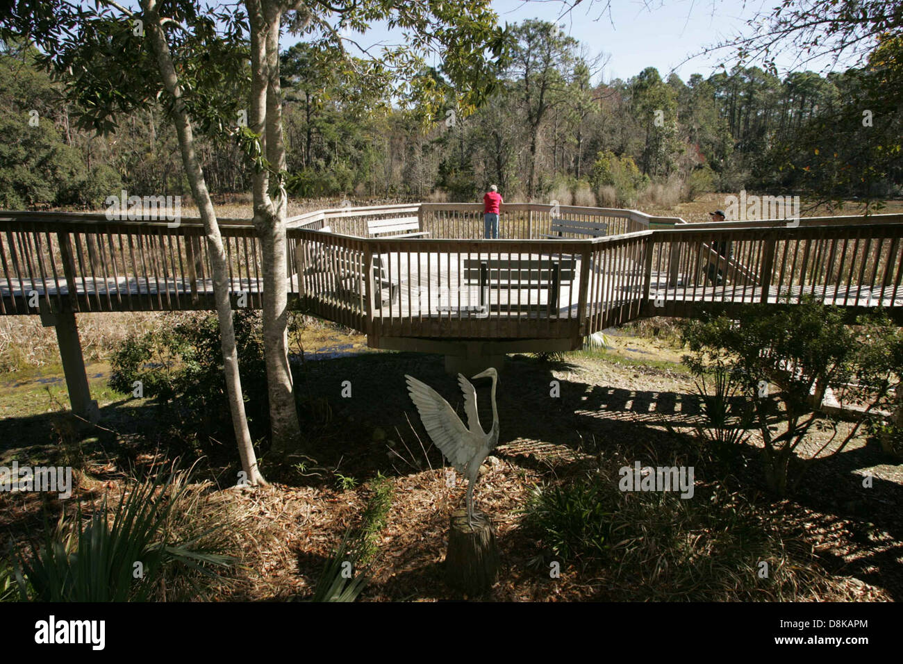 Visitors stand on an observation platform, enjoying the panoramic view ...