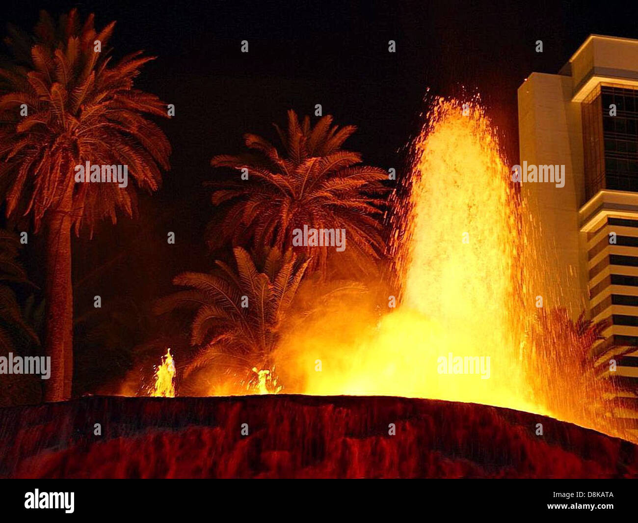 An image of a volcano with erupting lava, resembling a fountain. The ...