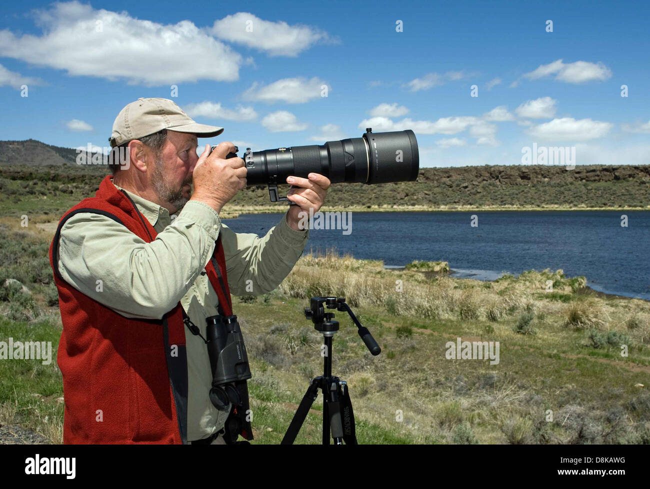 A volunteer photographer captures images during an event. The ...