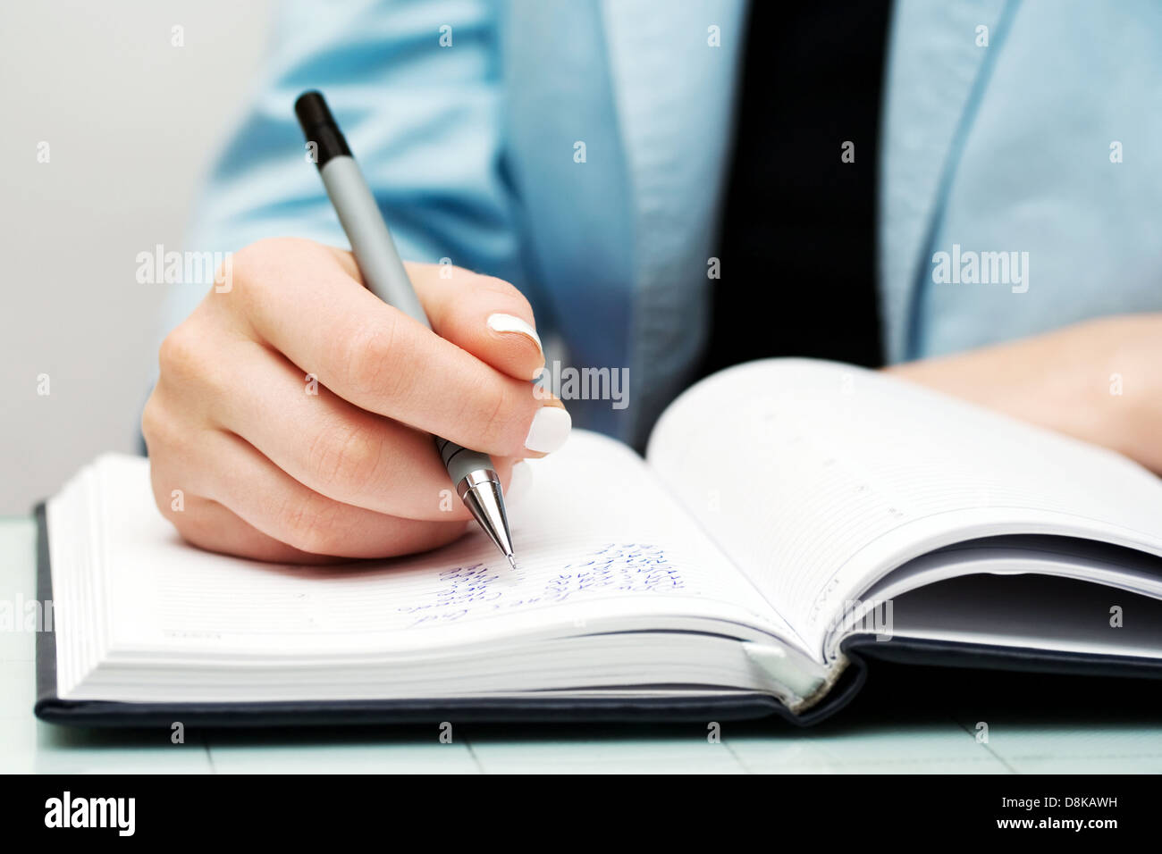 Female hands writing Stock Photo - Alamy