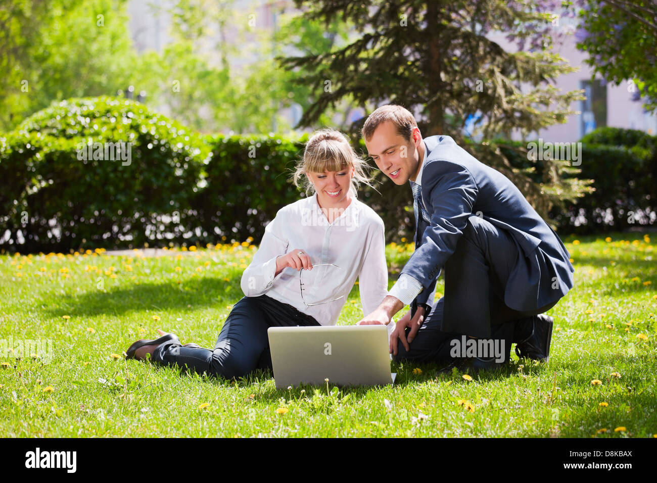 Young business people with laptop Stock Photo - Alamy