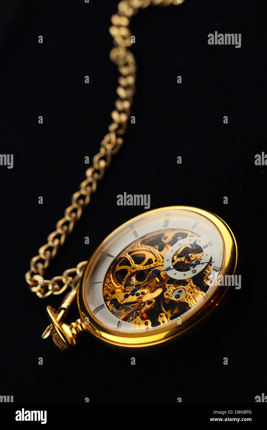 Old watch machine on dark background Stock Photo - Alamy