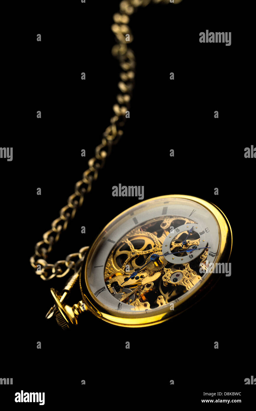 Old watch machine on dark background Stock Photo - Alamy