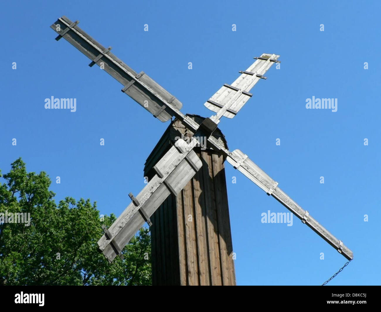 A windmill stands in a village, typically used for agricultural or ...
