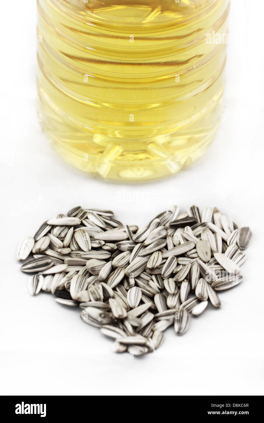 Sunflower seed and oil (white background Stock Photo - Alamy