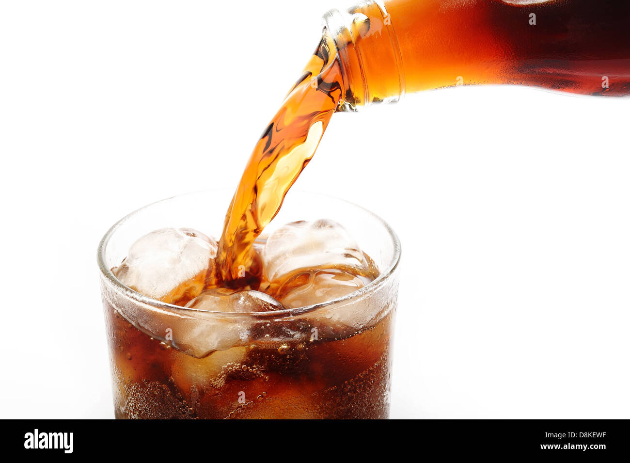 cola pouring into glass on white background Stock Photo - Alamy
