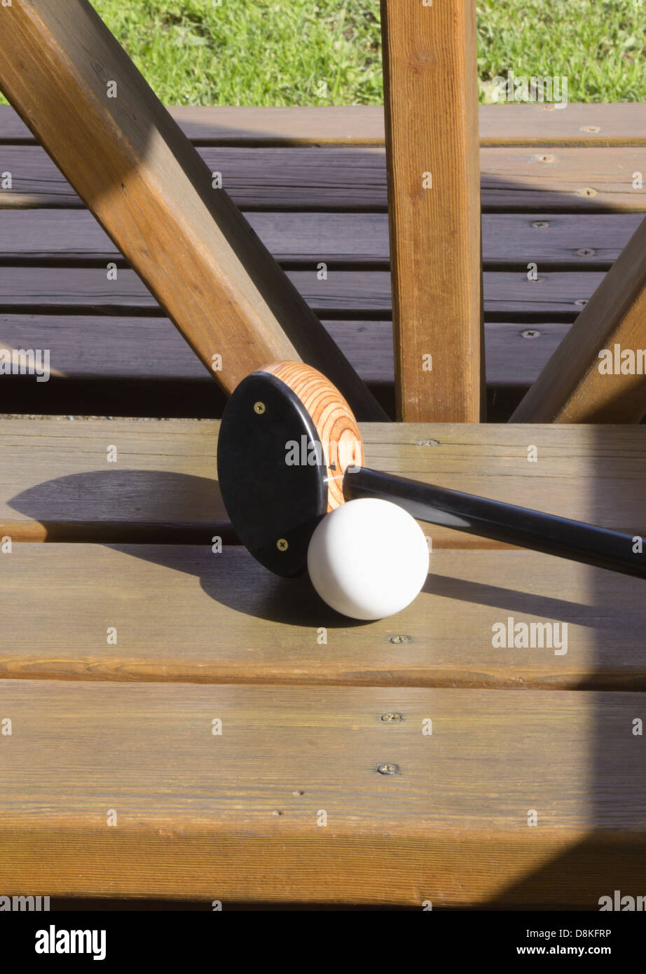 Park golf ball and a club Stock Photo - Alamy
