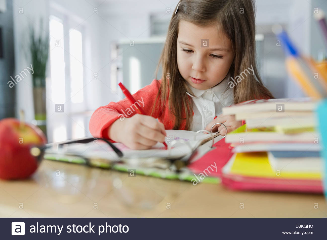 Girl writing in book hi-res stock photography and images - Alamy